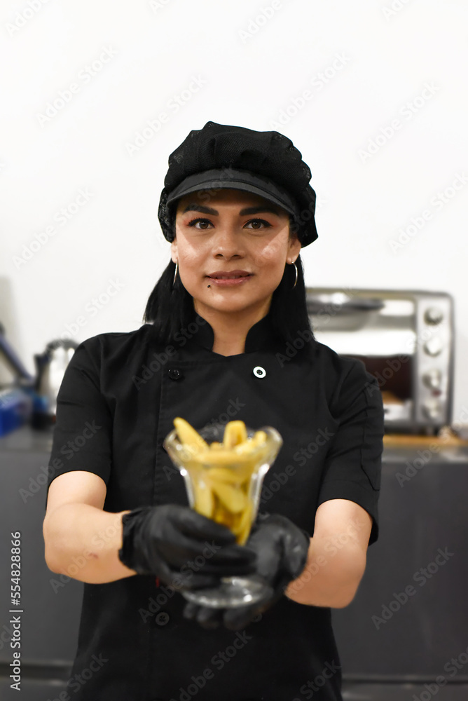 Mexican woman serving santa fe (caramelized banana with whisky) in ...