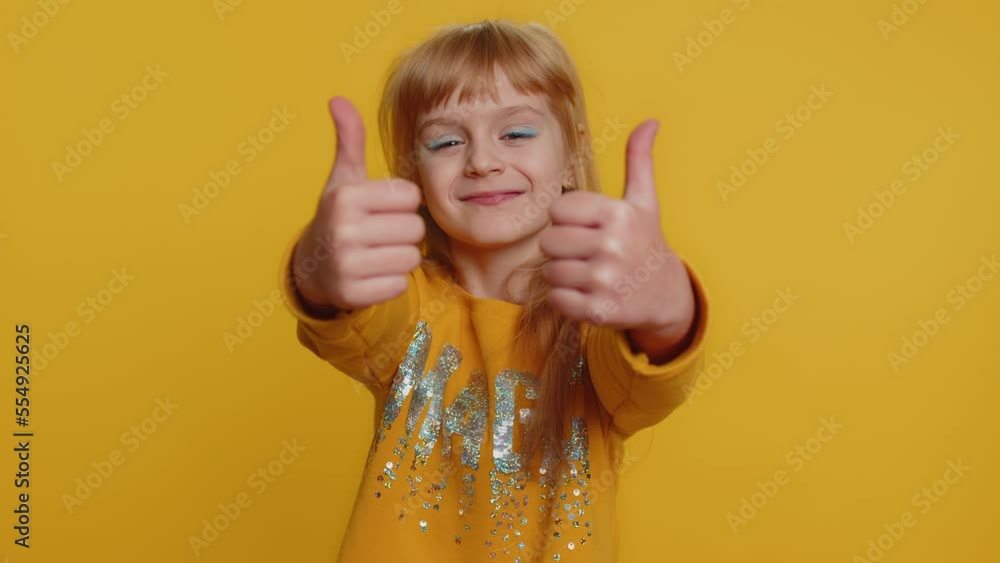 Like. Happy young preteen child girl kid looking approvingly at camera ...