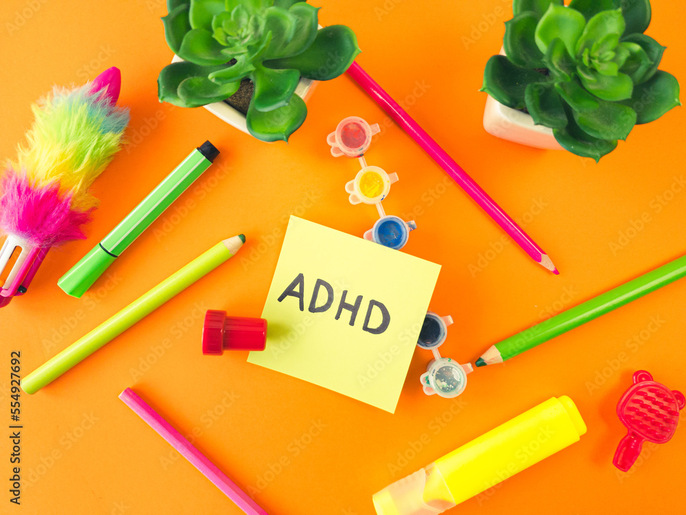 ADHD - attention deficit hyperactivity disorder handwritten on sticky ...