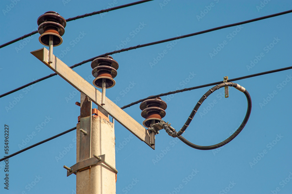 Power electric pole with line wire on colored background close up ...