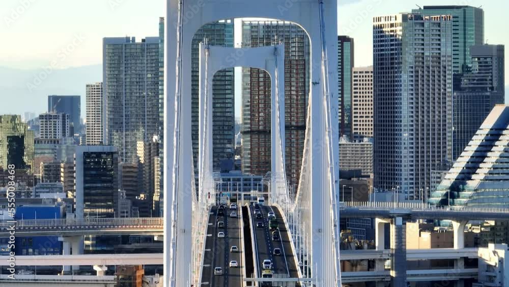 Suspension bridge with busy urban highway and moving traffic, aerial ...