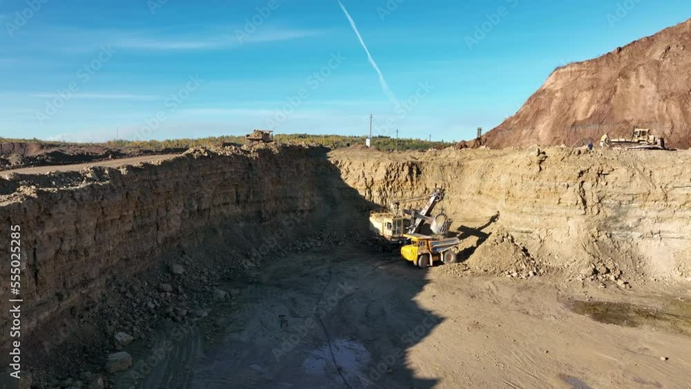 Excavator load dolomite rock in haul truck in open pit mining. Mining ...