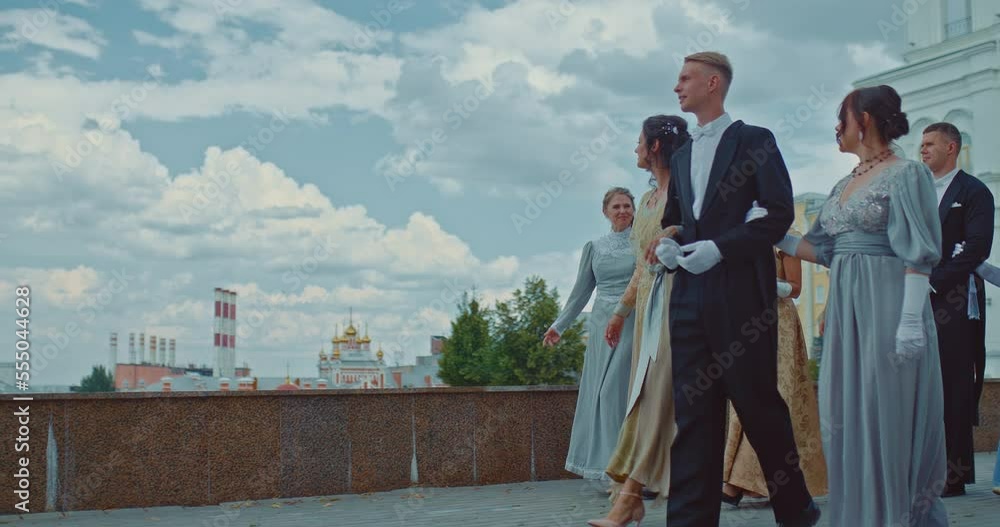 Beautiful women in elegant dresses with lace walk through the Ukrainian ...