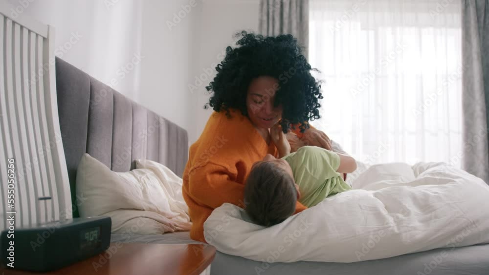 Mum and child tender moments fun time in 4K slow motion. Loving African ...