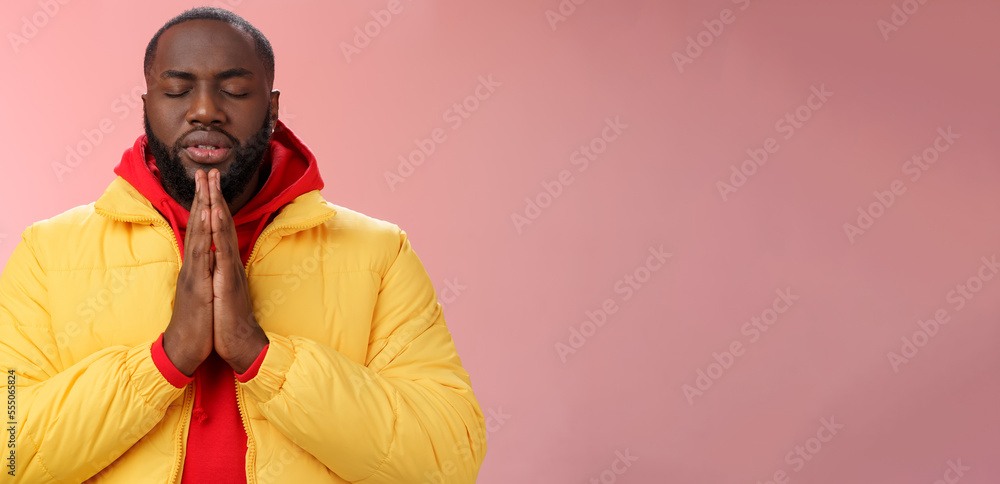 Serious-looking faithful young determined african-american praying guy ...