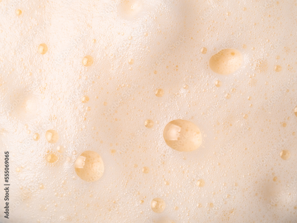 Foam texture extreme close up as background. Milkshake or cappucino ...