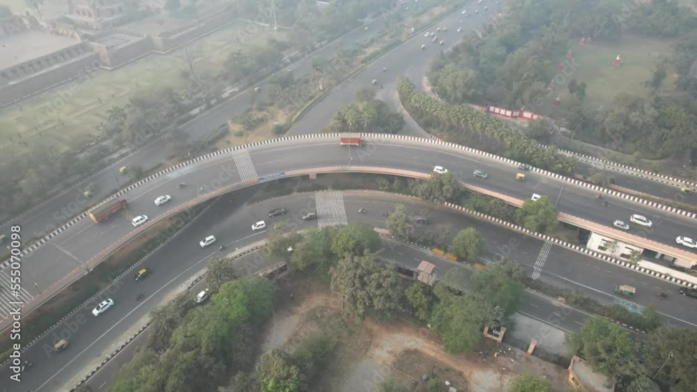 Aerial Drone Footage of a Road in New Delhi India with Traffic Vehicles ...