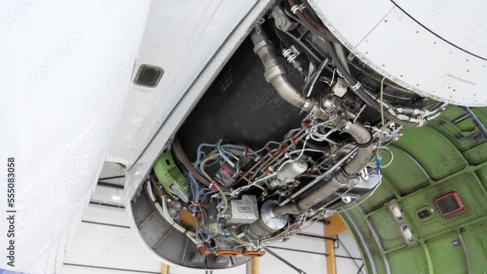 Airplane Jet Engine with Open Cover in Maintenance Hangar, Tilt Up ...