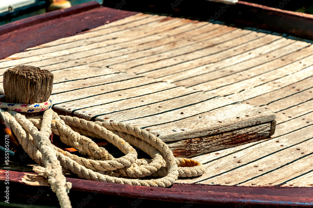 Details of wooden boat bow with forward hatch and some rope Stock Photo ...