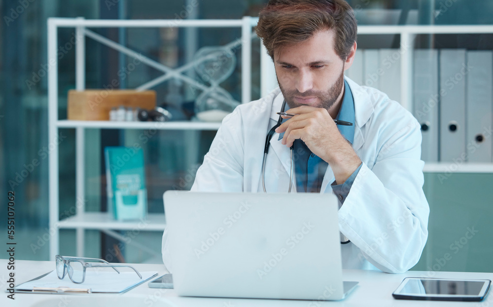 Doctor, scientist and laptop with a man reading and thinking while ...