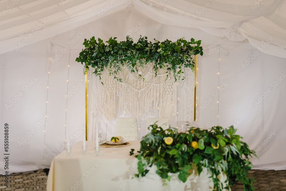 Festive table, arch decorated leaves eucalyptus greenery and garland ...