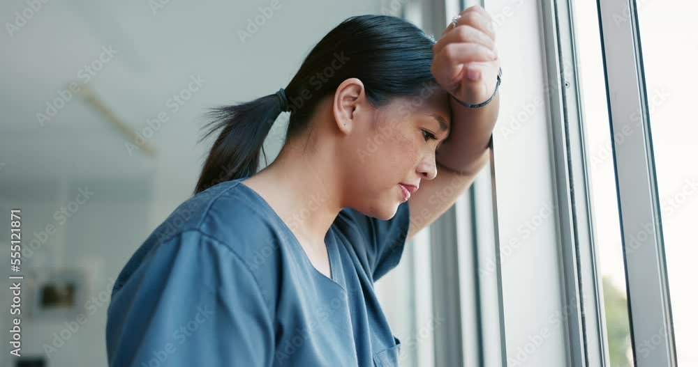 Healthcare nurse, stress and headache by window for working burnout ...