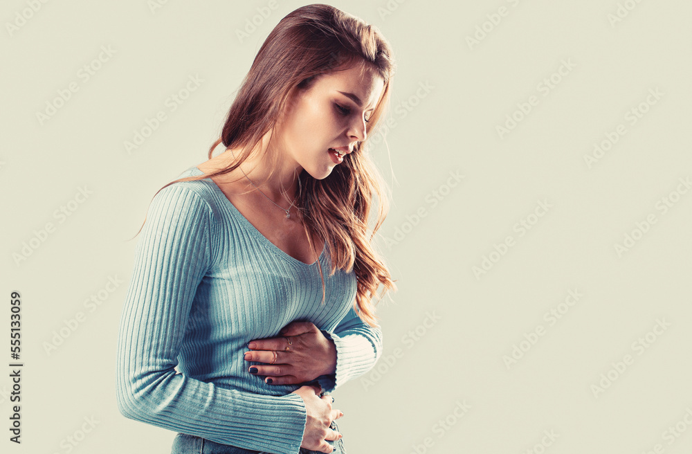 Girl having a stomachache. Young woman suffering from abdominal pain ...