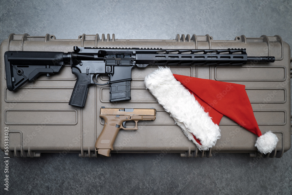 Christmas and guns, ar 15 rifle and pistol with santa hat. Stock Photo ...