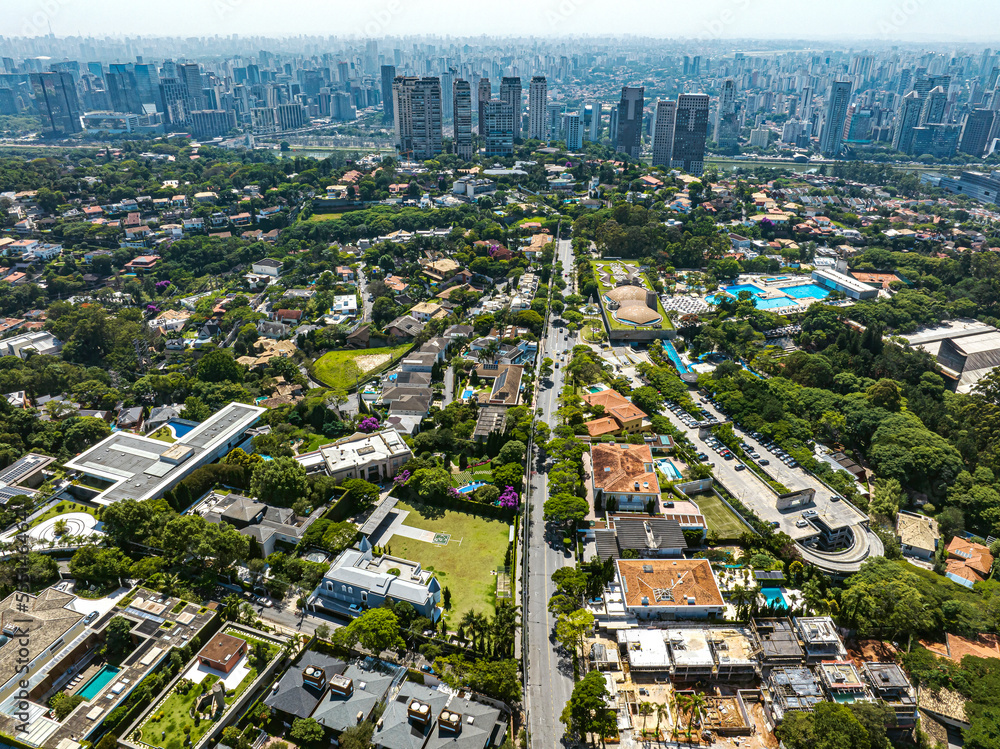 Aerial view of a luxury neighborhood with swimming pool and big ...