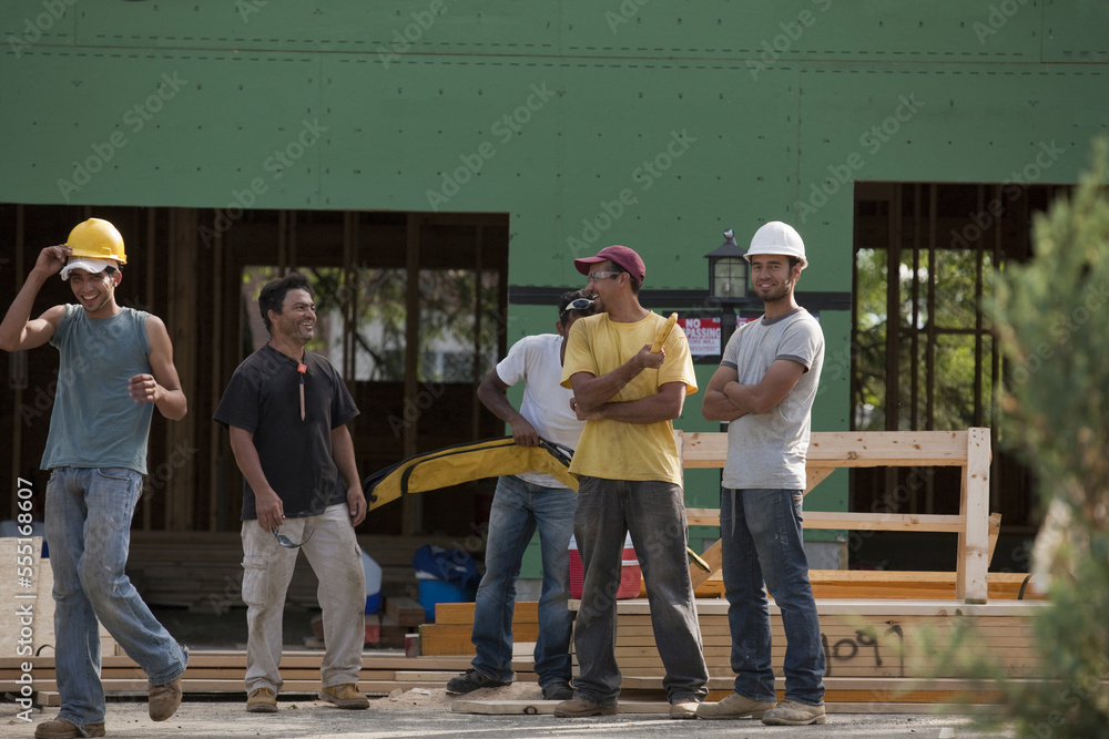 Construction workers relaxing at the end of the day after work Stock ...