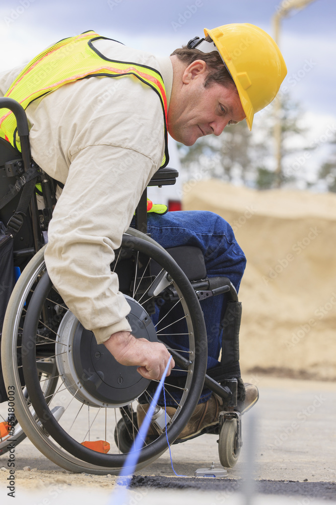 Construction supervisor with Spinal Cord Injury pulling chalkline at ...