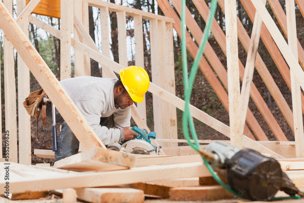 Carpenter making bevel cut using a circular saw Stock Photo | Adobe Stock