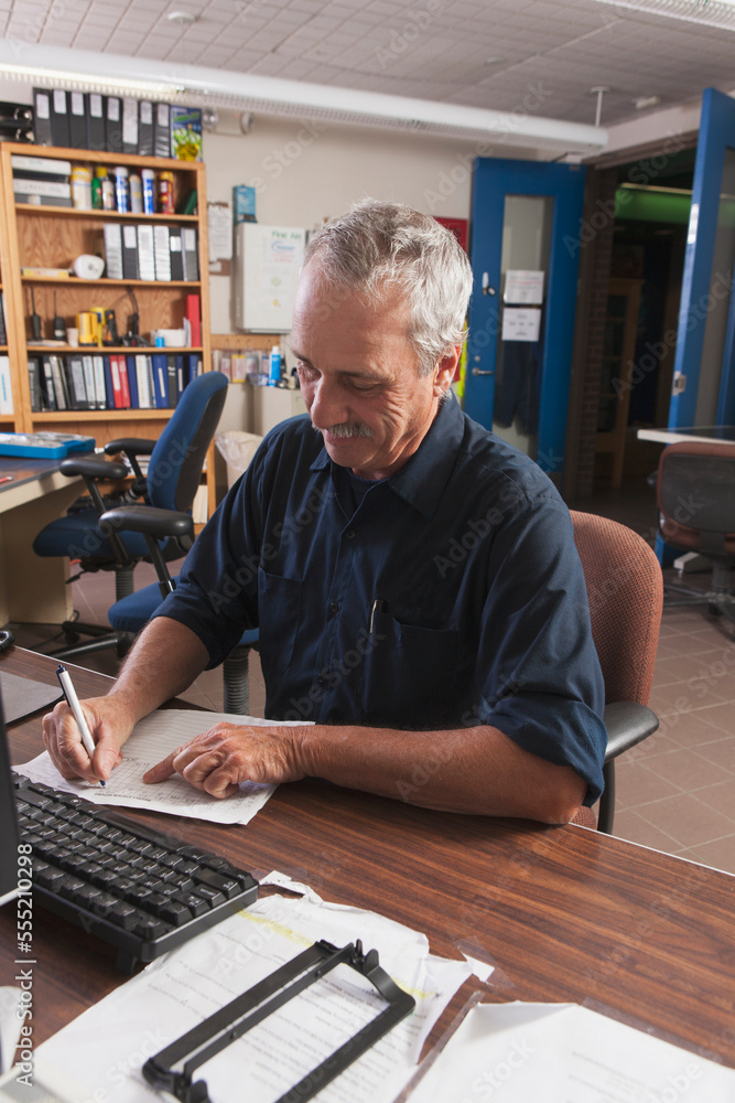 Engineer recording data at public works control center Stock Photo ...