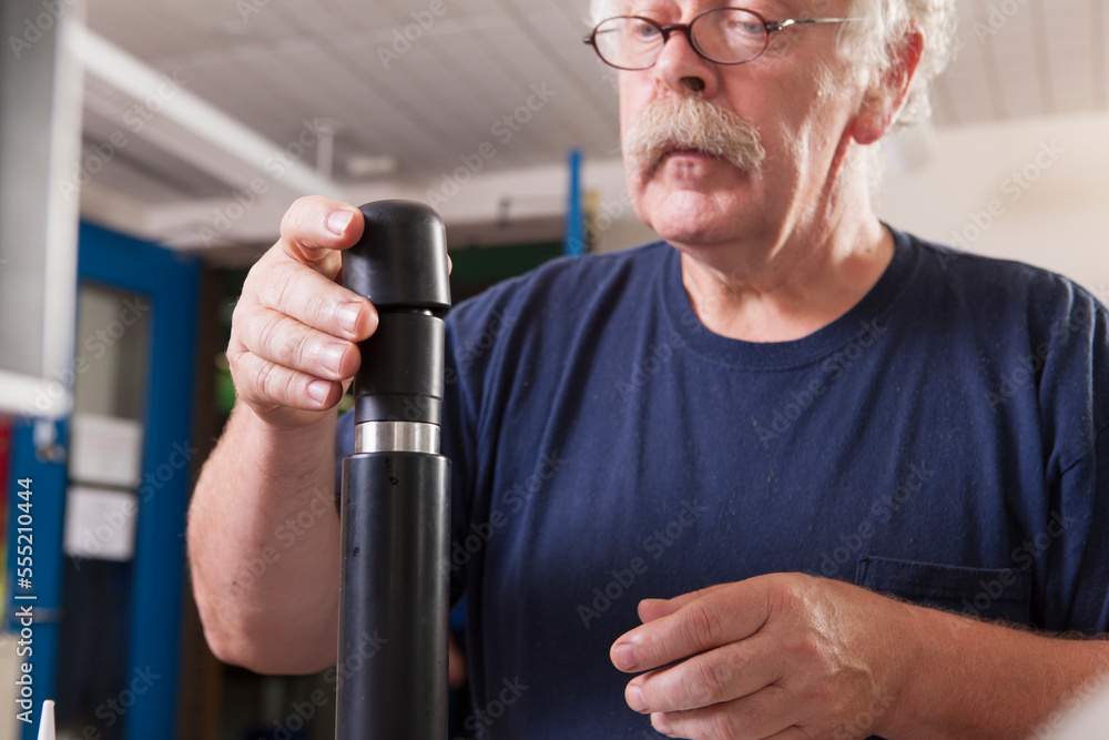 Engineer installing new membranes in an O2 electrochemical sensor probe ...