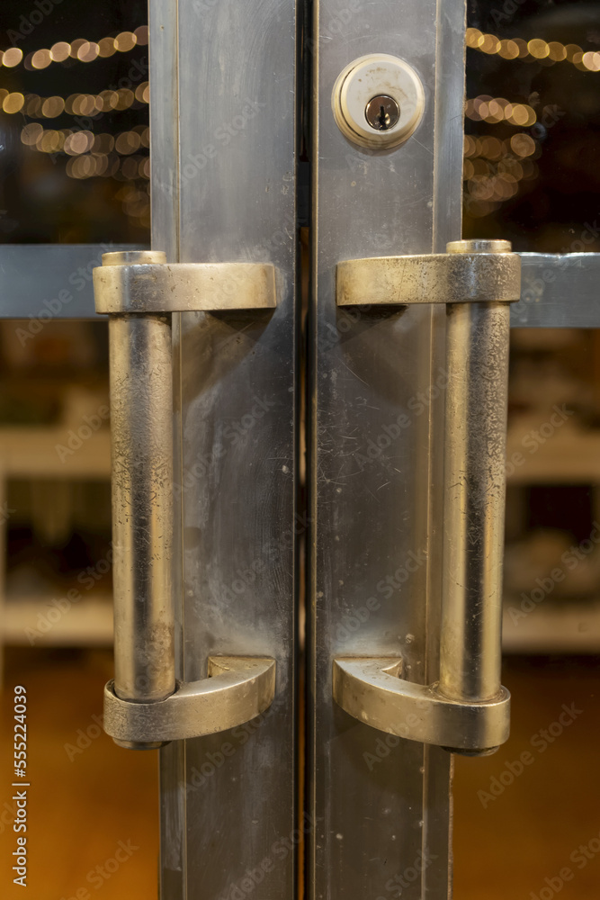 Long door handles and lock on a set of double glass doors; Franklin ...
