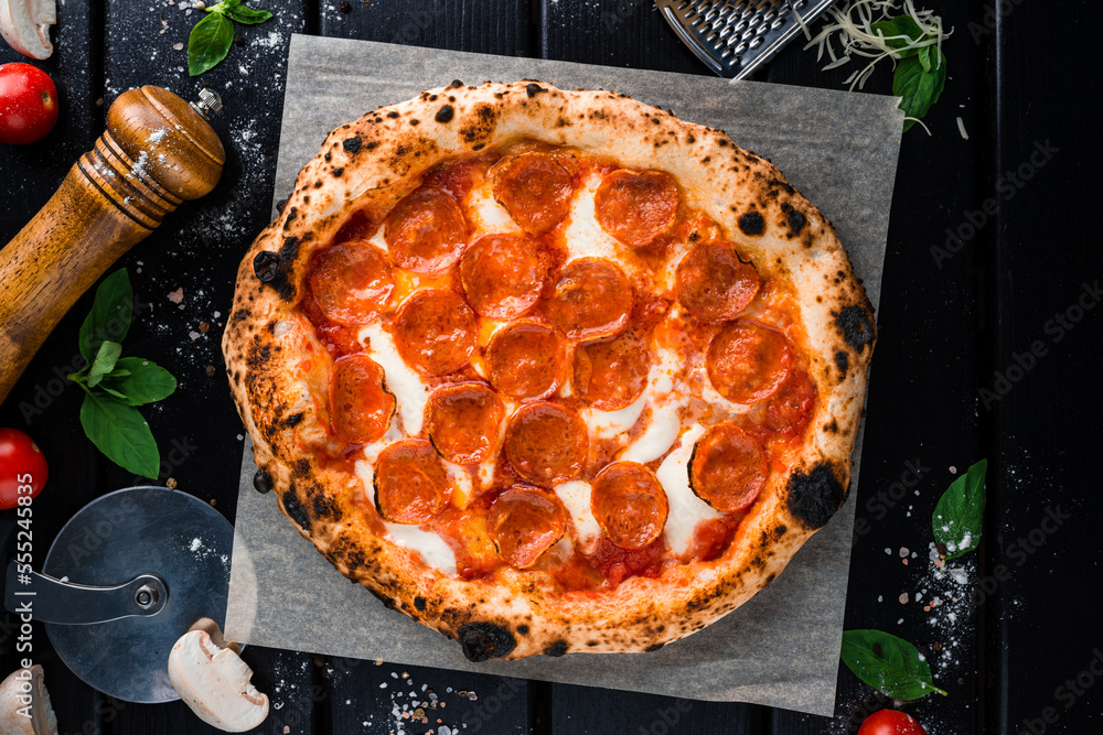 Neapolitan pepperoni pizza with mozzarella, tomato sauce on thick dough ...