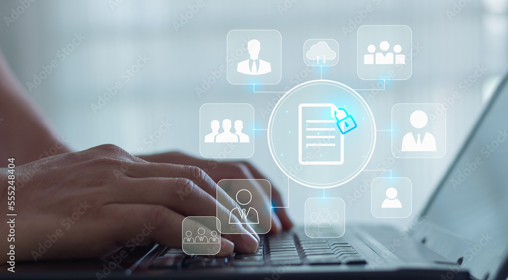 Document Management System(DMS) concept. User typing on laptop computer ...