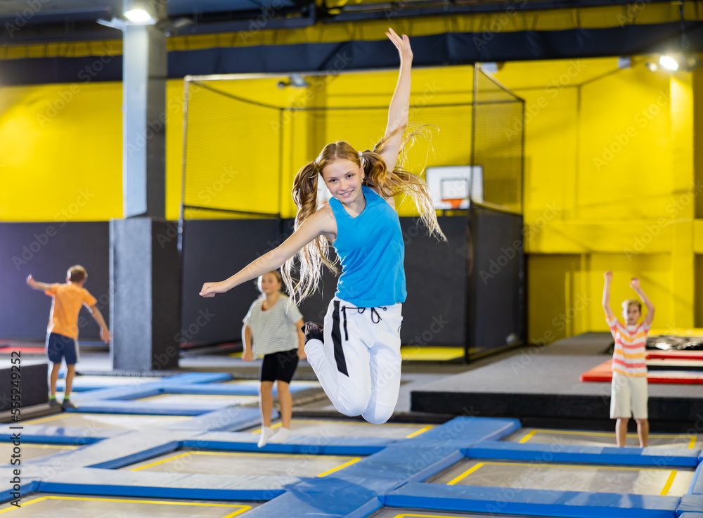 Tween Girl Having Fun Jumping In Indoor Trampoline Arena Stock Photo ...