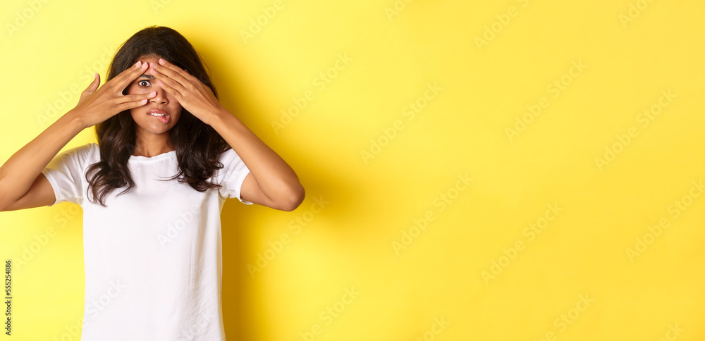 Portrait of embarrassed and shocked african-american girl, shut her ...