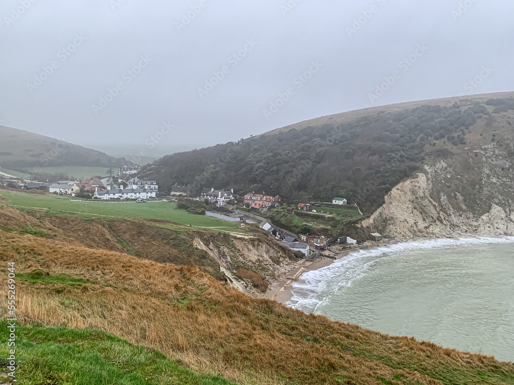 Lulworth Cove and beach view at winter cloudy cold day. Lulworth Cove ...