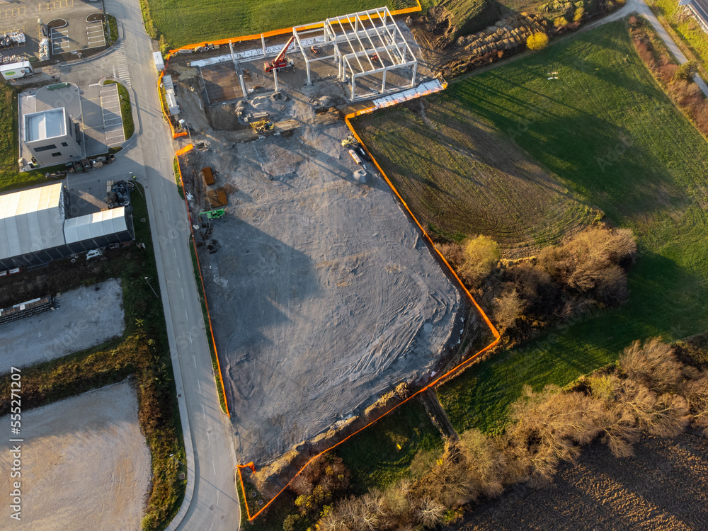 Prefabricated concrete skeleton frame building being constructed, building site, aerial view ...