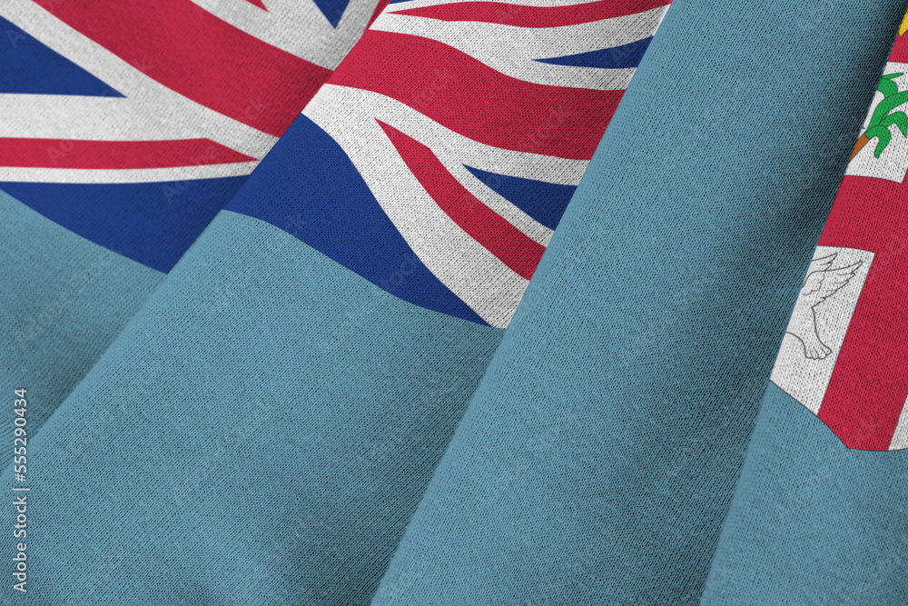 Fiji flag with big folds waving close up under the studio light indoors ...