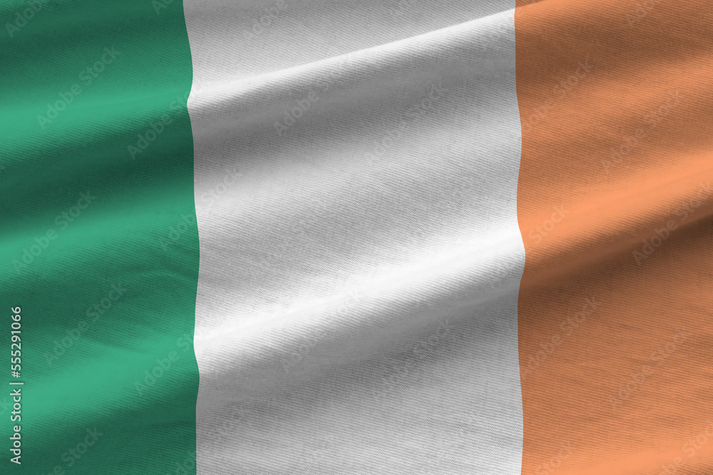 Ireland flag with big folds waving close up under the studio light ...