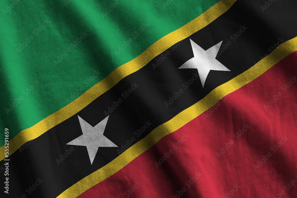 Saint Kitts and Nevis flag with big folds waving close up under the ...