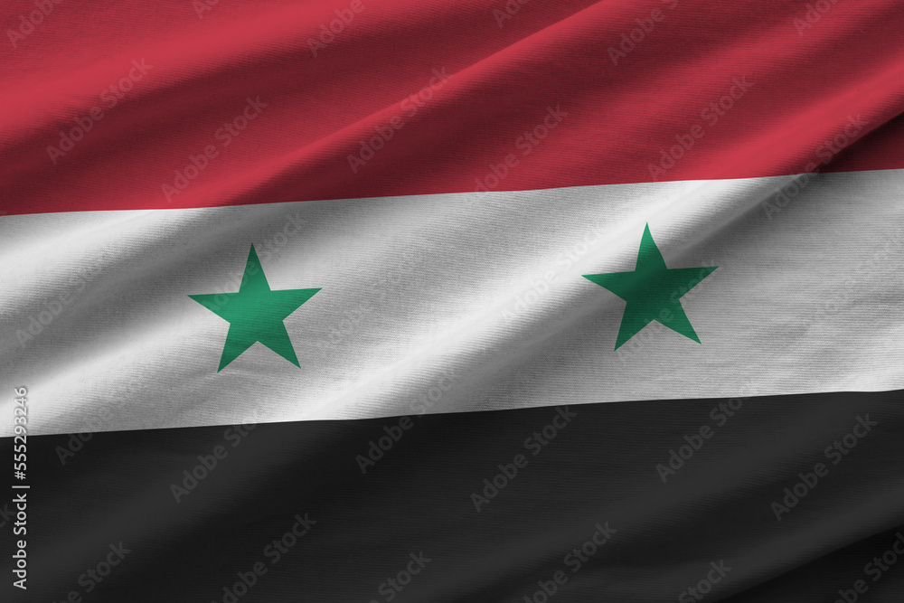 Syria flag with big folds waving close up under the studio light ...