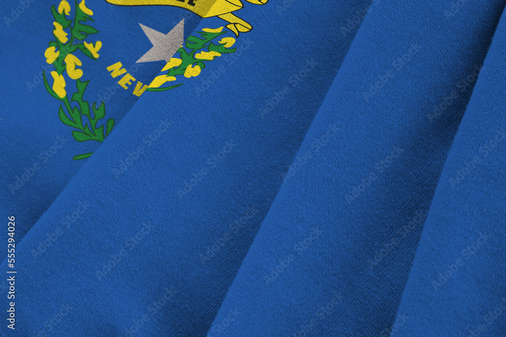 Nevada US state flag with big folds waving close up under the studio ...