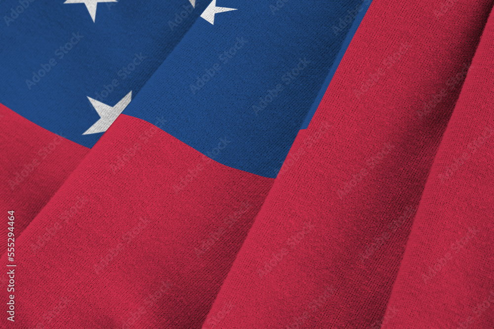 Samoa flag with big folds waving close up under the studio light ...