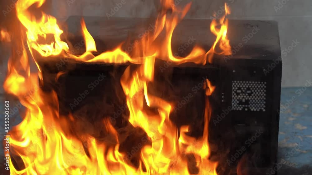 microwave oven on fire. the concept of fire in the kitchen and ...