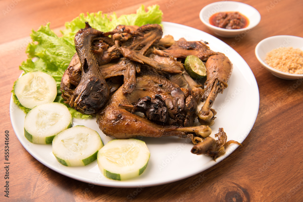 Sweet soy sauce grilled whole chicken, is a popular dish in Java and ...