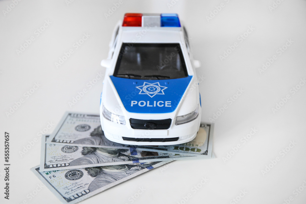 Police car and a wad of money. Call the police. Fine. Bribes. Police ...