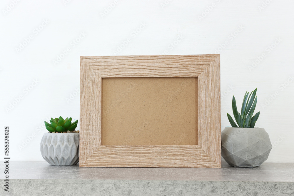 white background and table with empty photo frame for product display ...