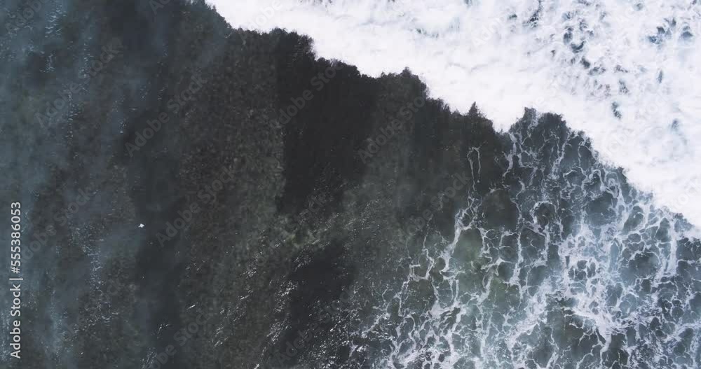 Wavy surface of sea or ocean. Big waves with white foam, splashing each ...
