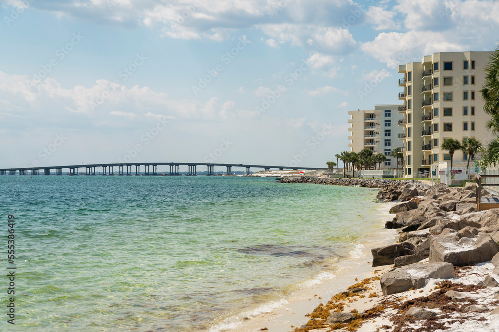 Destin, Florida bay with views of the bridge and beachfront hotels ...