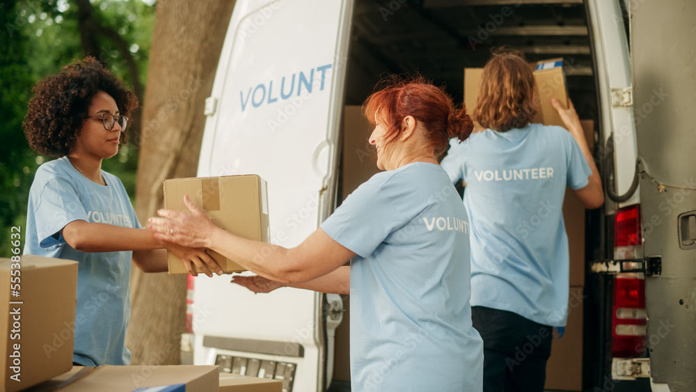 Happy Team of Young Volunteers Preparing Humanitarian Aid and Donations ...