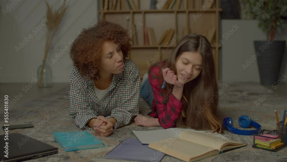 Smart adorable multiracial teenage girl with caring charming African ...