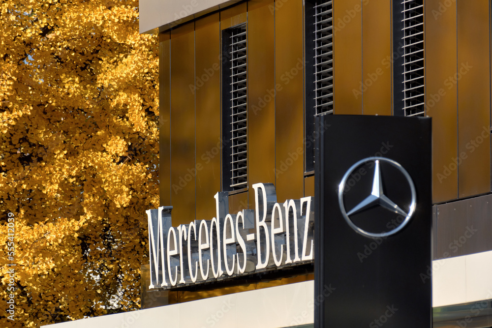 logo and sign of Mercedes Benz placed on the facade of a garage in ...