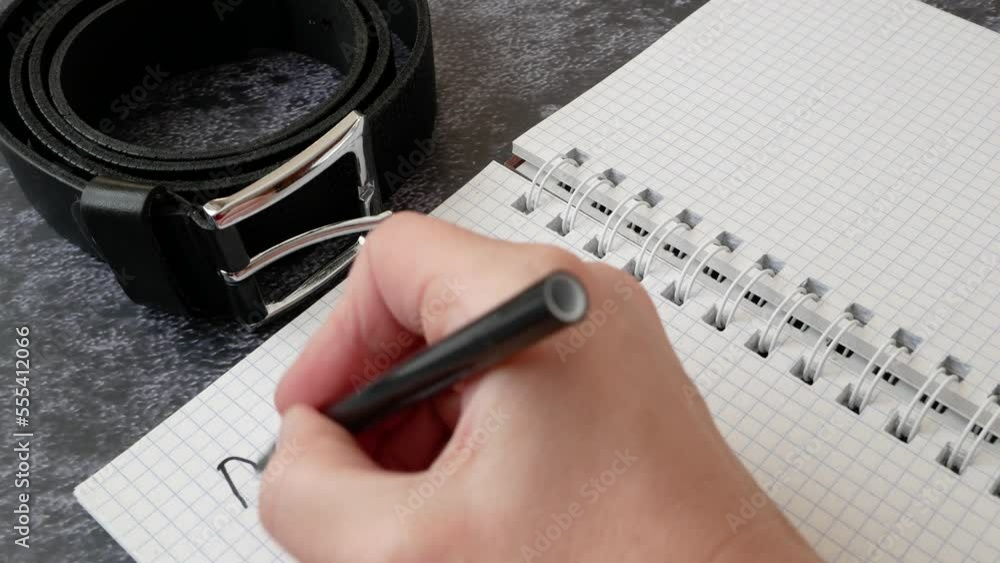 notebook with psychological trauma inscription and dark leather male ...