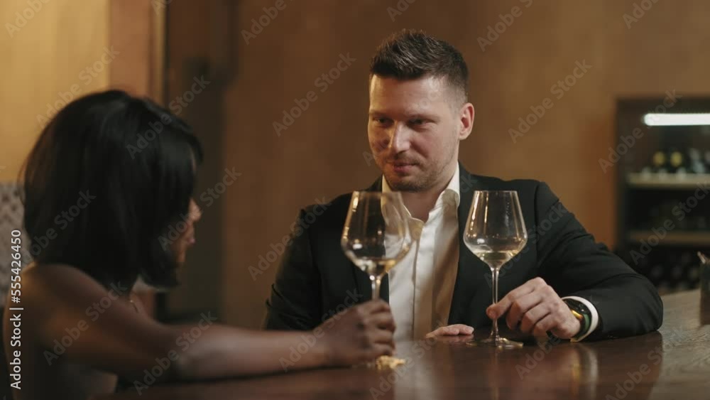 pick up in bar, man and woman talking near bar, drinking wine and ...
