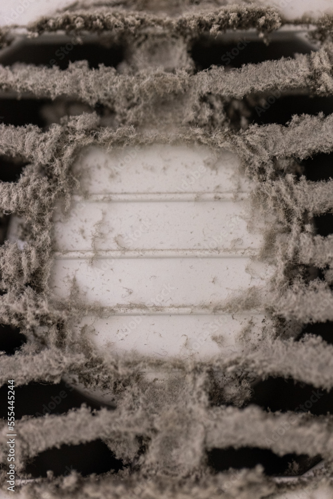 Very dirty and dusty white plastic air vent. The ventilation shaft in ...