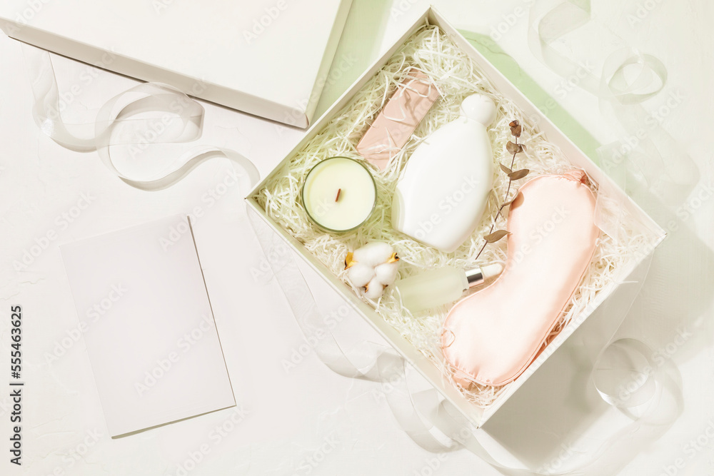 Holiday mock up of white gift box with sleep care set. Self care ...
